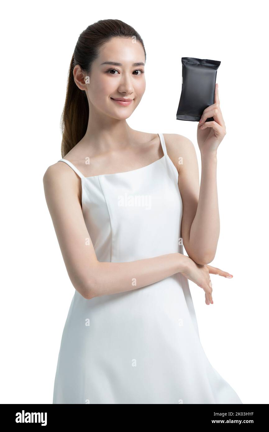 Beautiful young Chinese woman showing wet wipe Stock Photo - Alamy