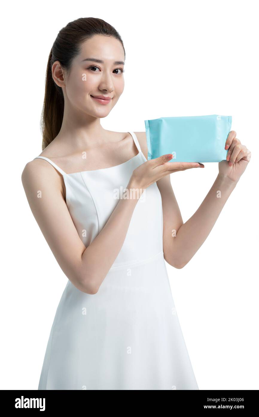 Beautiful young Chinese woman showing wet wipe Stock Photo - Alamy