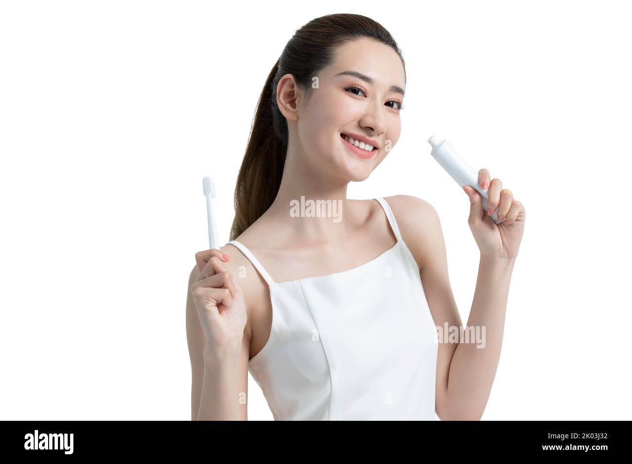 Beautiful young Chinese woman brushing teeth Stock Photo - Alamy