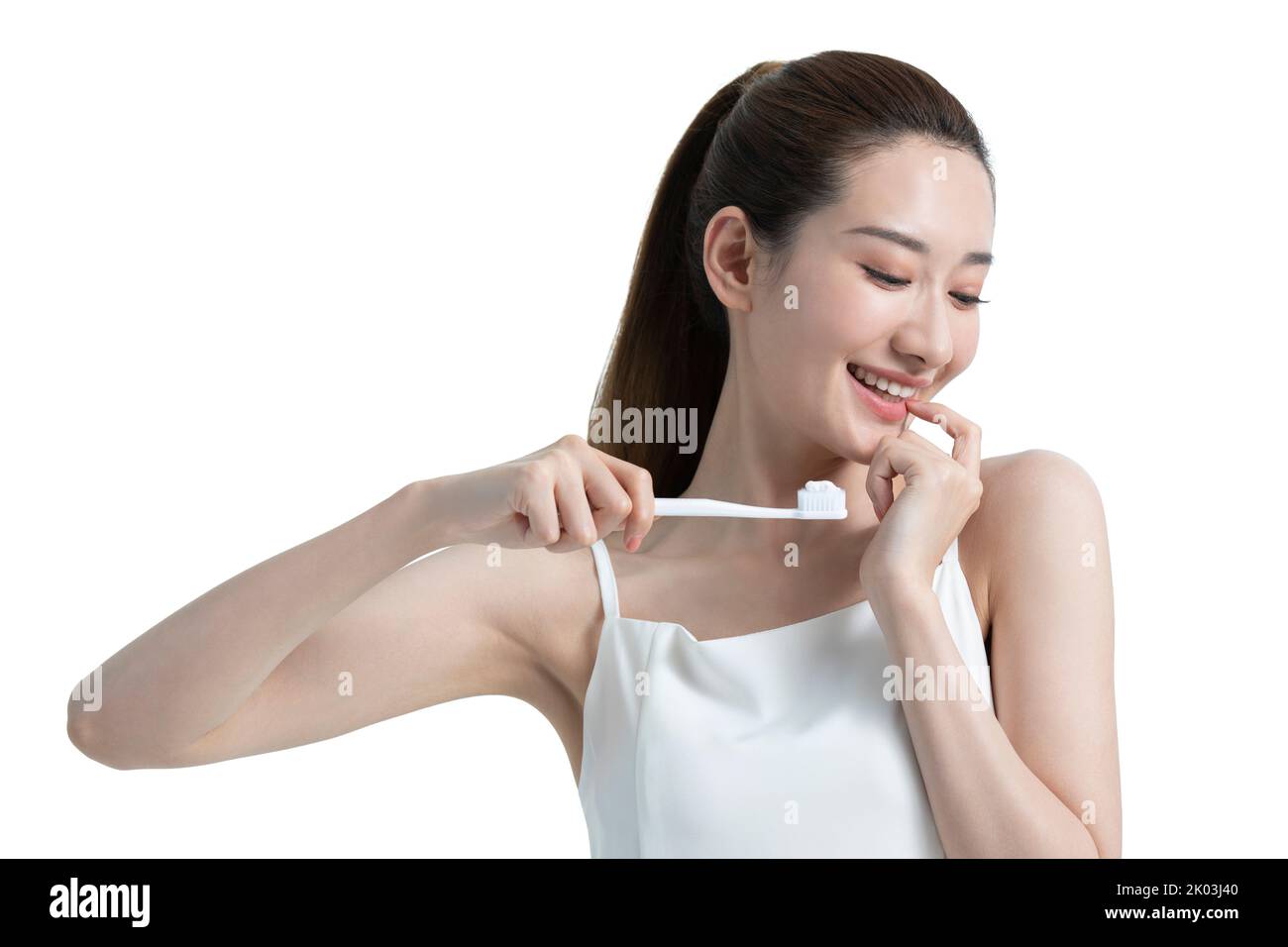 Beautiful young Chinese woman brushing teeth Stock Photo - Alamy