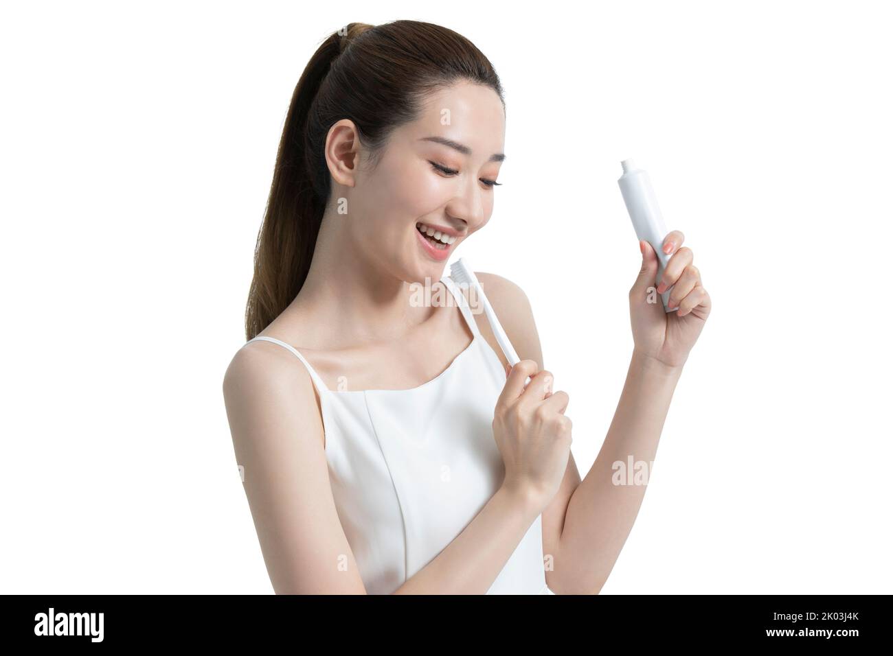 Beautiful young Chinese woman brushing teeth Stock Photo - Alamy