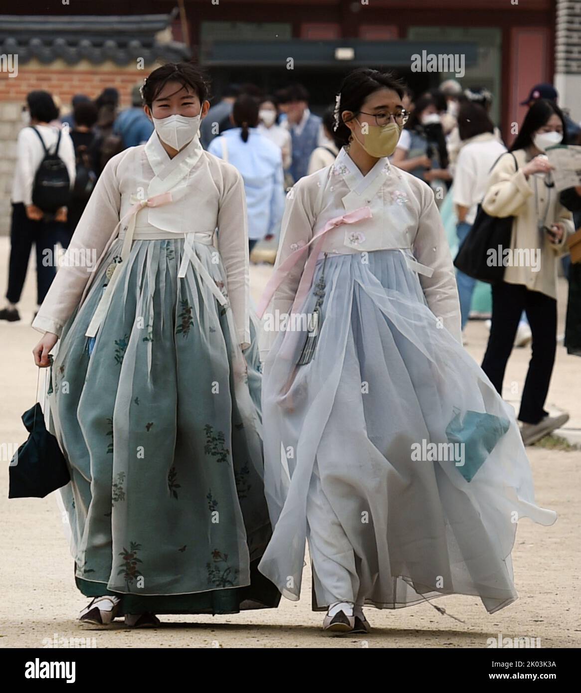 Traditional hanbok are worn by visitors to Gyeongbokgung Palace the ...