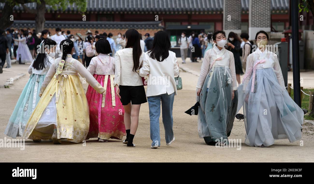 Traditional hanbok are worn by visitors to Gyeongbokgung Palace the ...