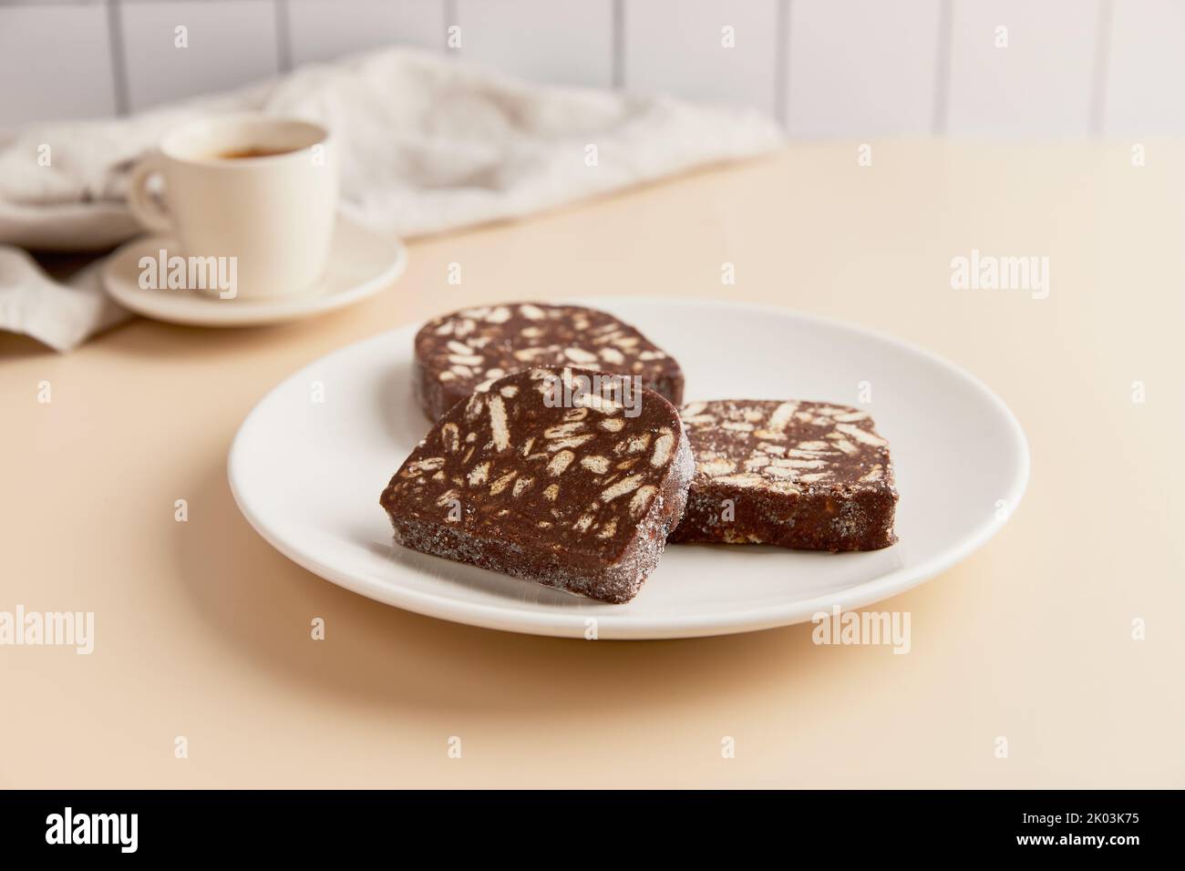 Traditional portuguese dessert Salame de Chocolate on beige background ...