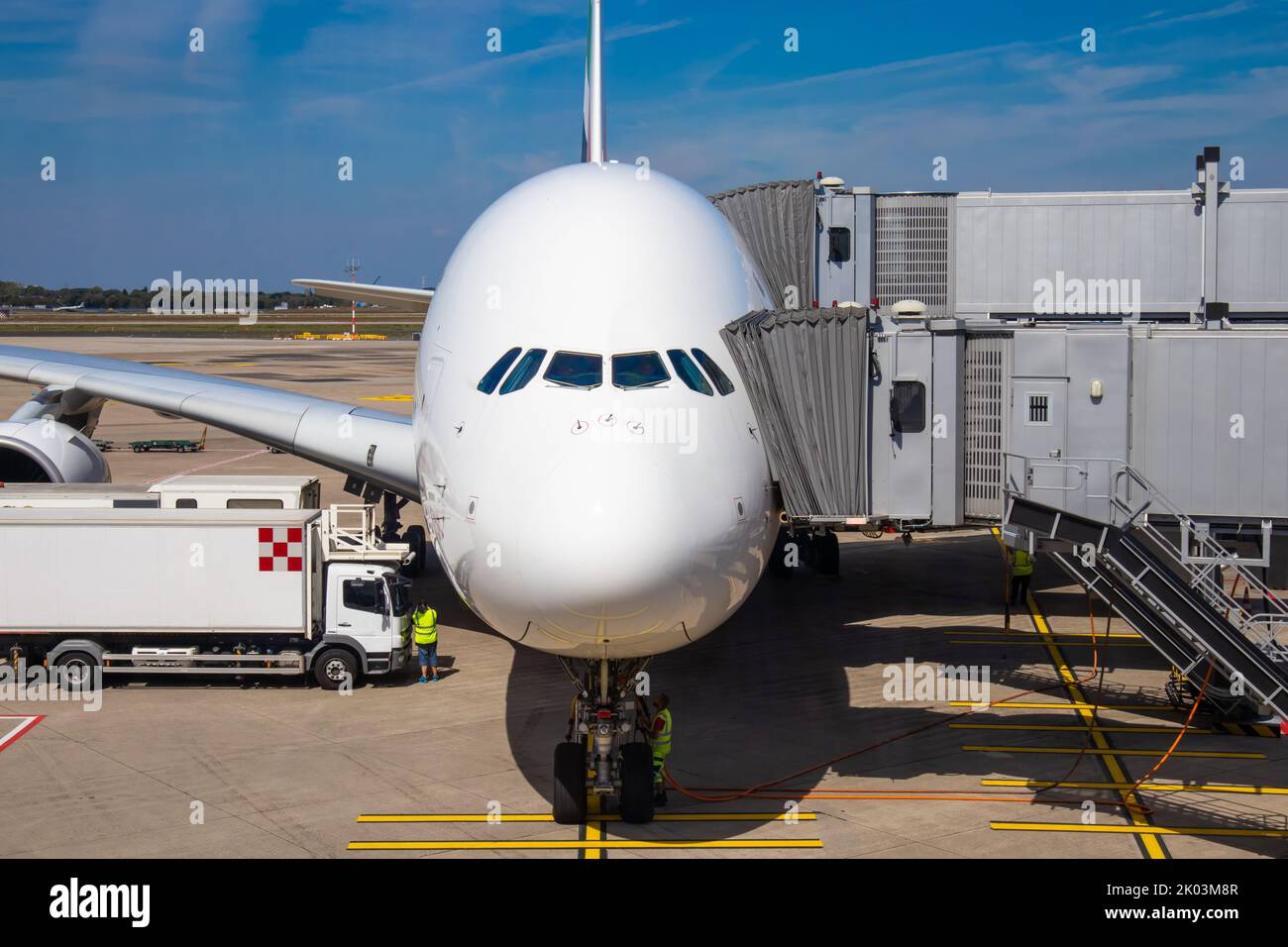 Passenger plane at the airport near the terminal stands Stock Photo - Alamy