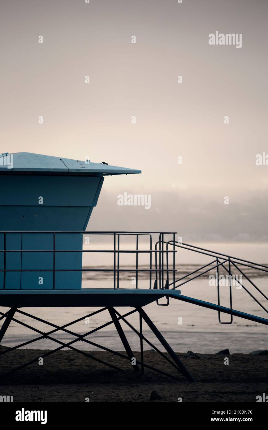 Light blue lifeguard tower on a beach in California, on a cloudy and ...