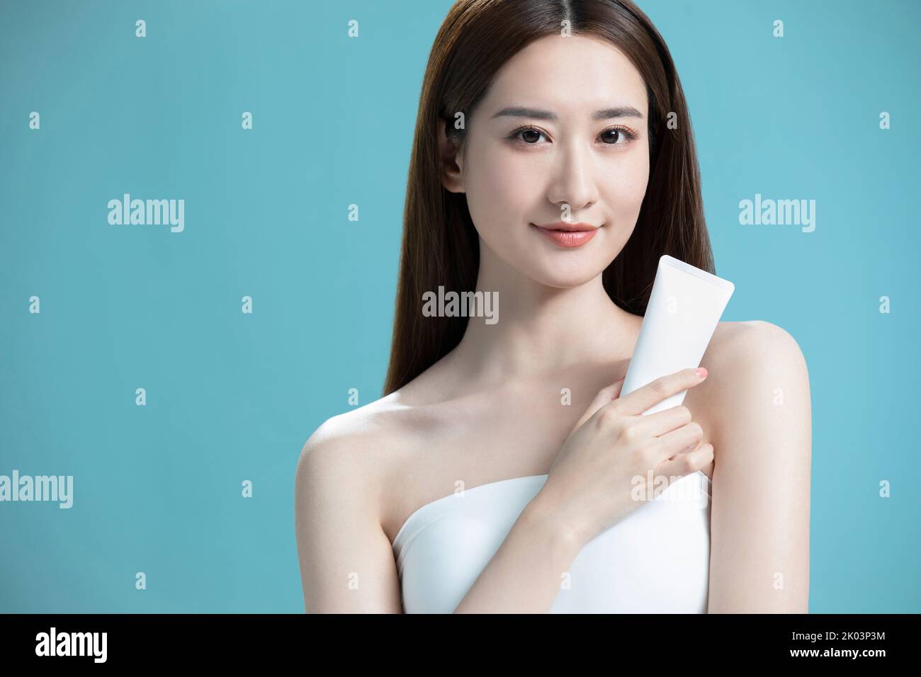Beautiful young Chinese woman with face wash Stock Photo - Alamy