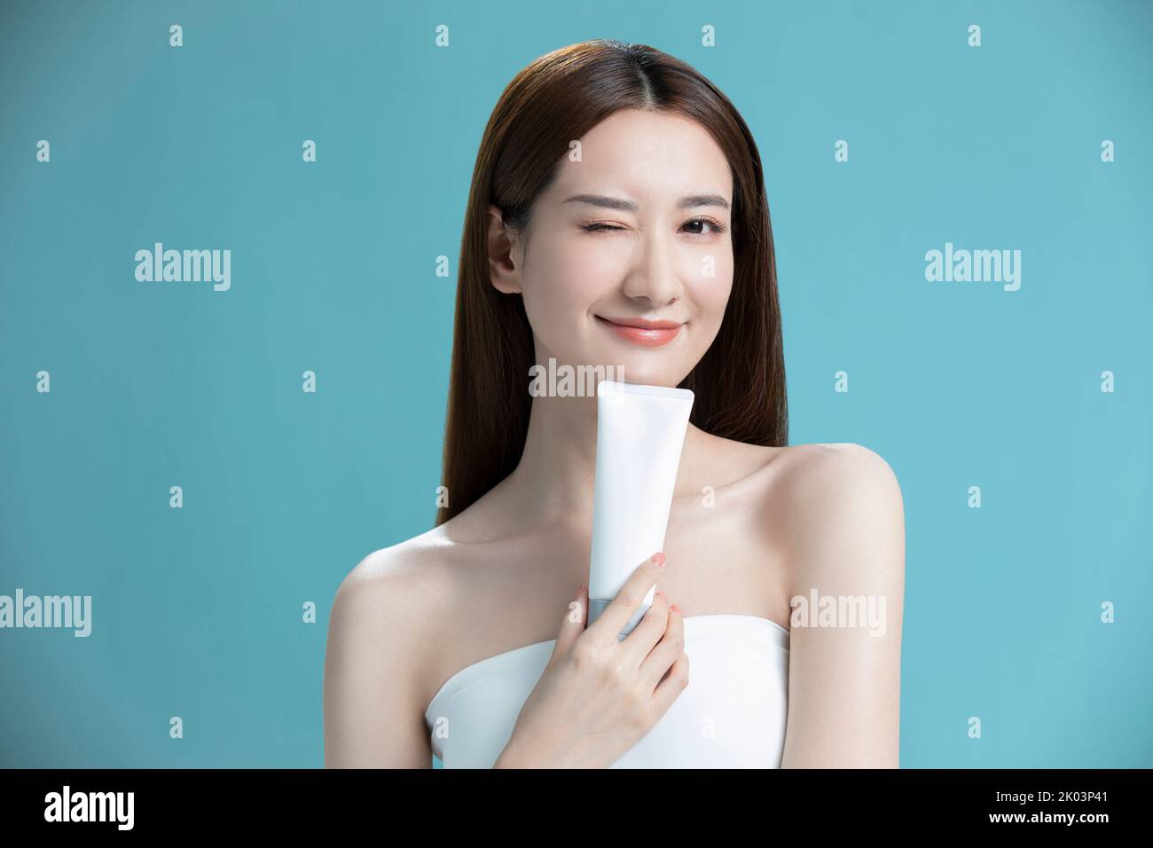 Beautiful young Chinese woman with face wash Stock Photo - Alamy
