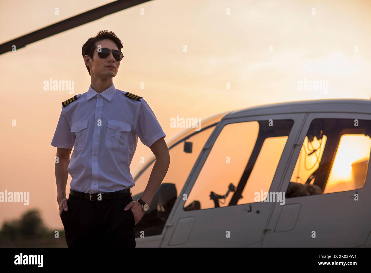 Chinese helicopter pilot standing by the vehicle Stock Photo - Alamy