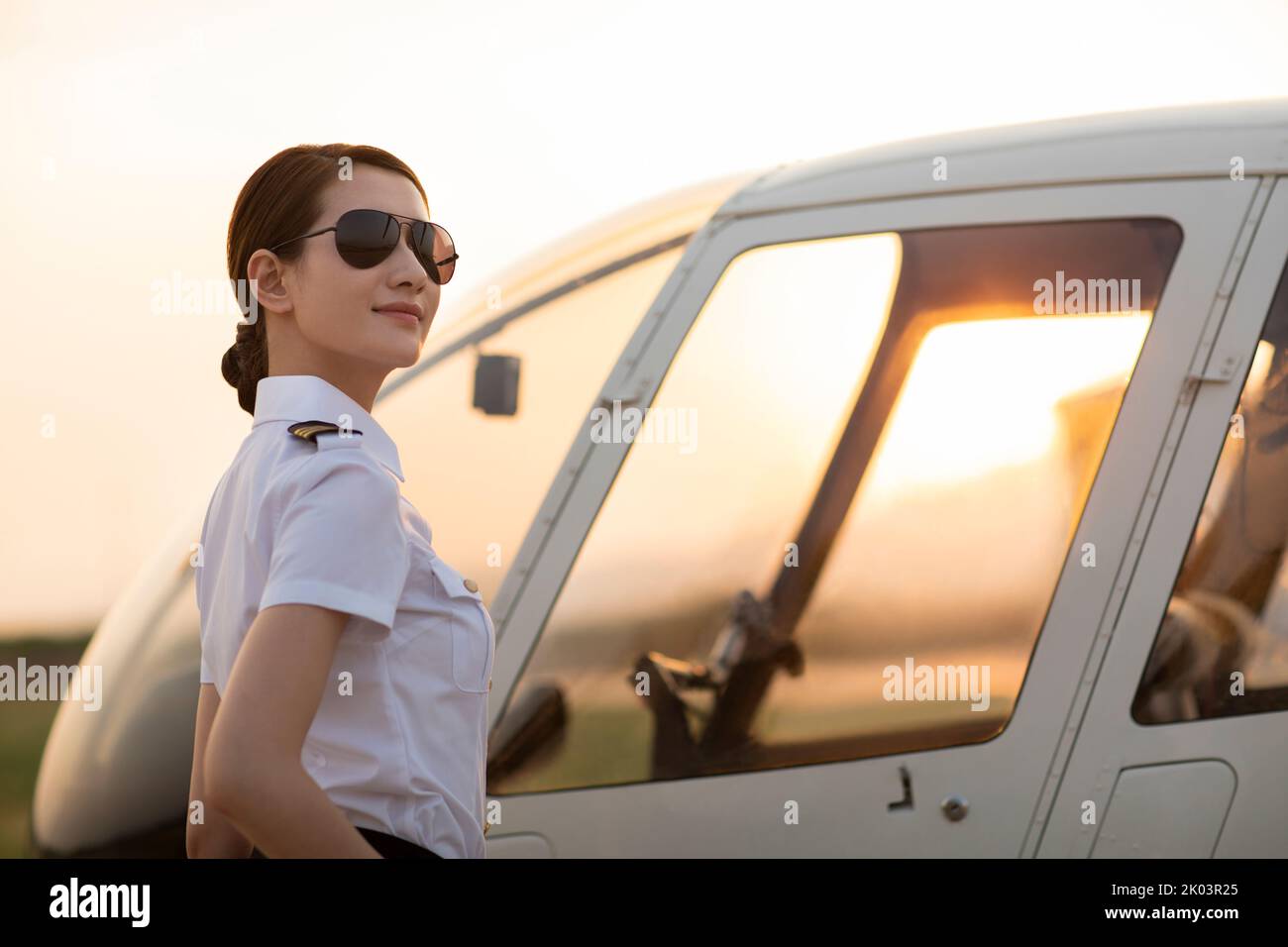 Chinese helicopter pilot standing by the vehicle Stock Photo - Alamy