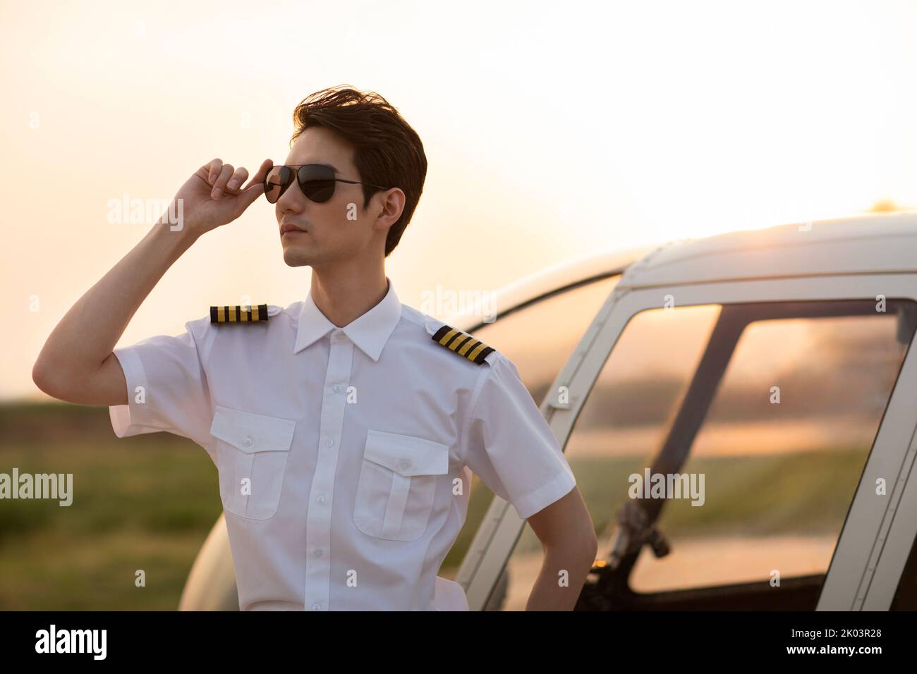 Chinese helicopter pilot standing by the vehicle Stock Photo - Alamy