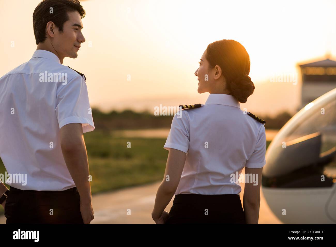 Chinese pilots walking to the helicopter Stock Photo - Alamy