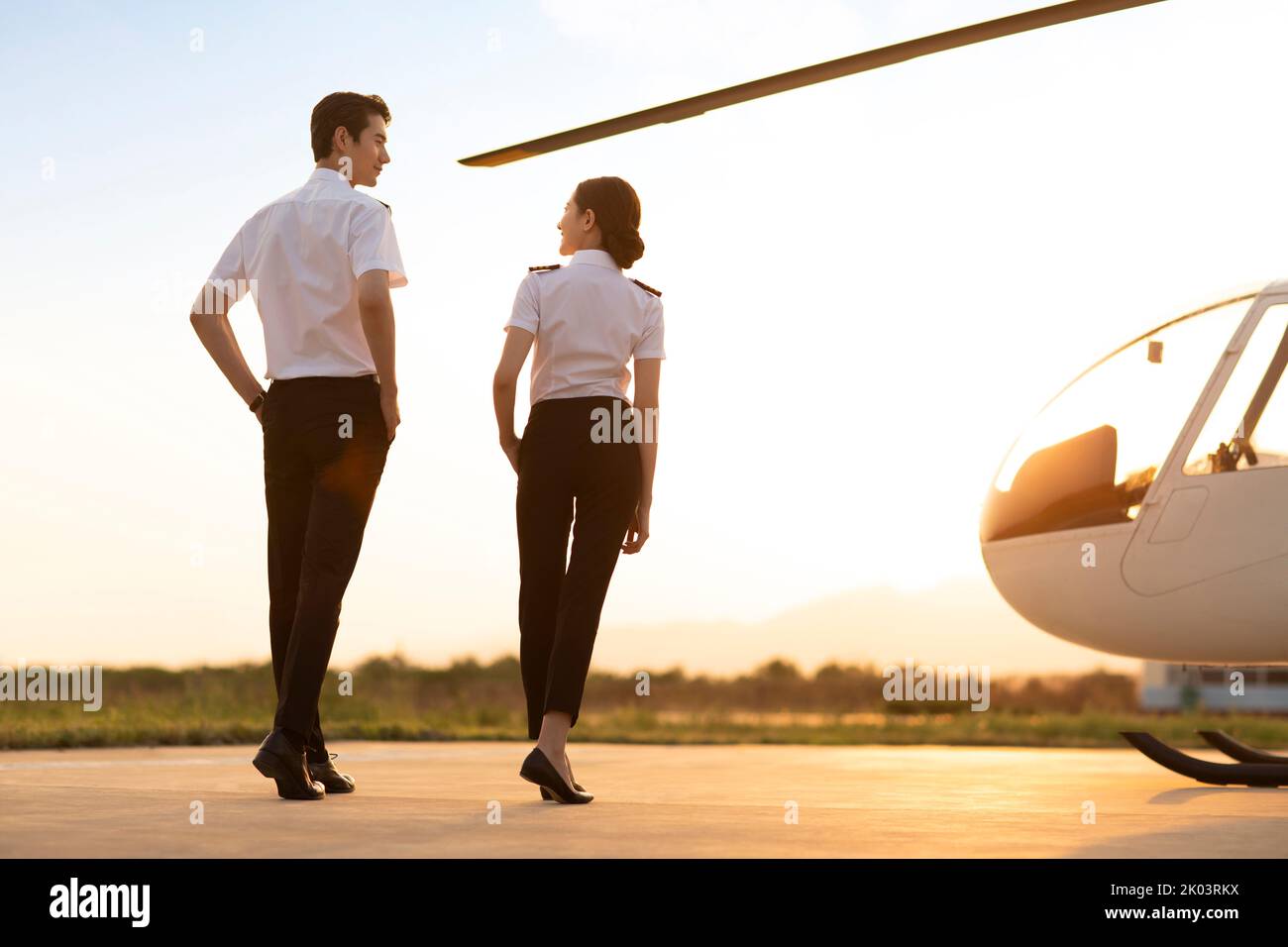 Chinese pilots walking to the helicopter Stock Photo - Alamy