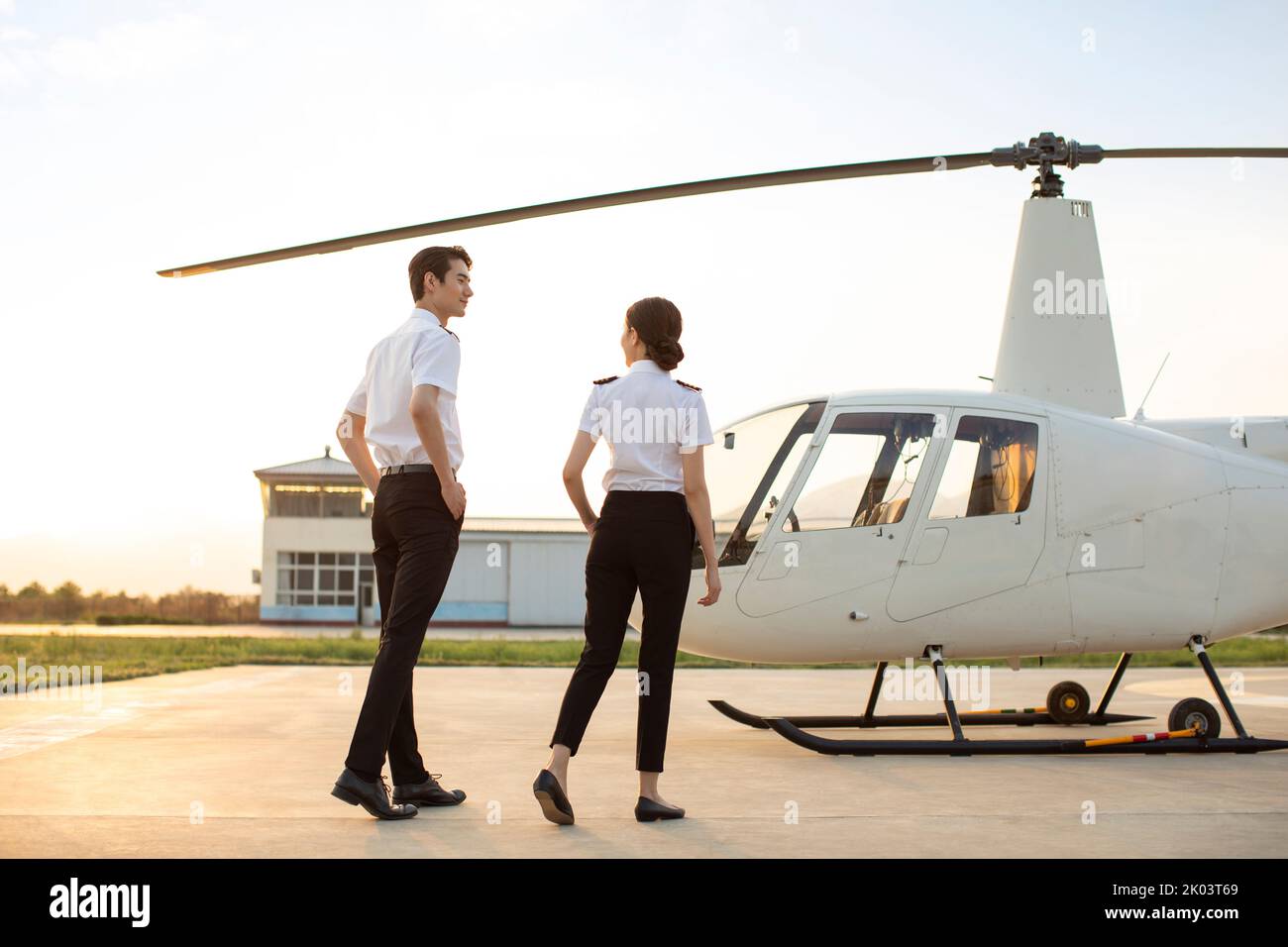 Chinese pilots walking to the helicopter Stock Photo - Alamy