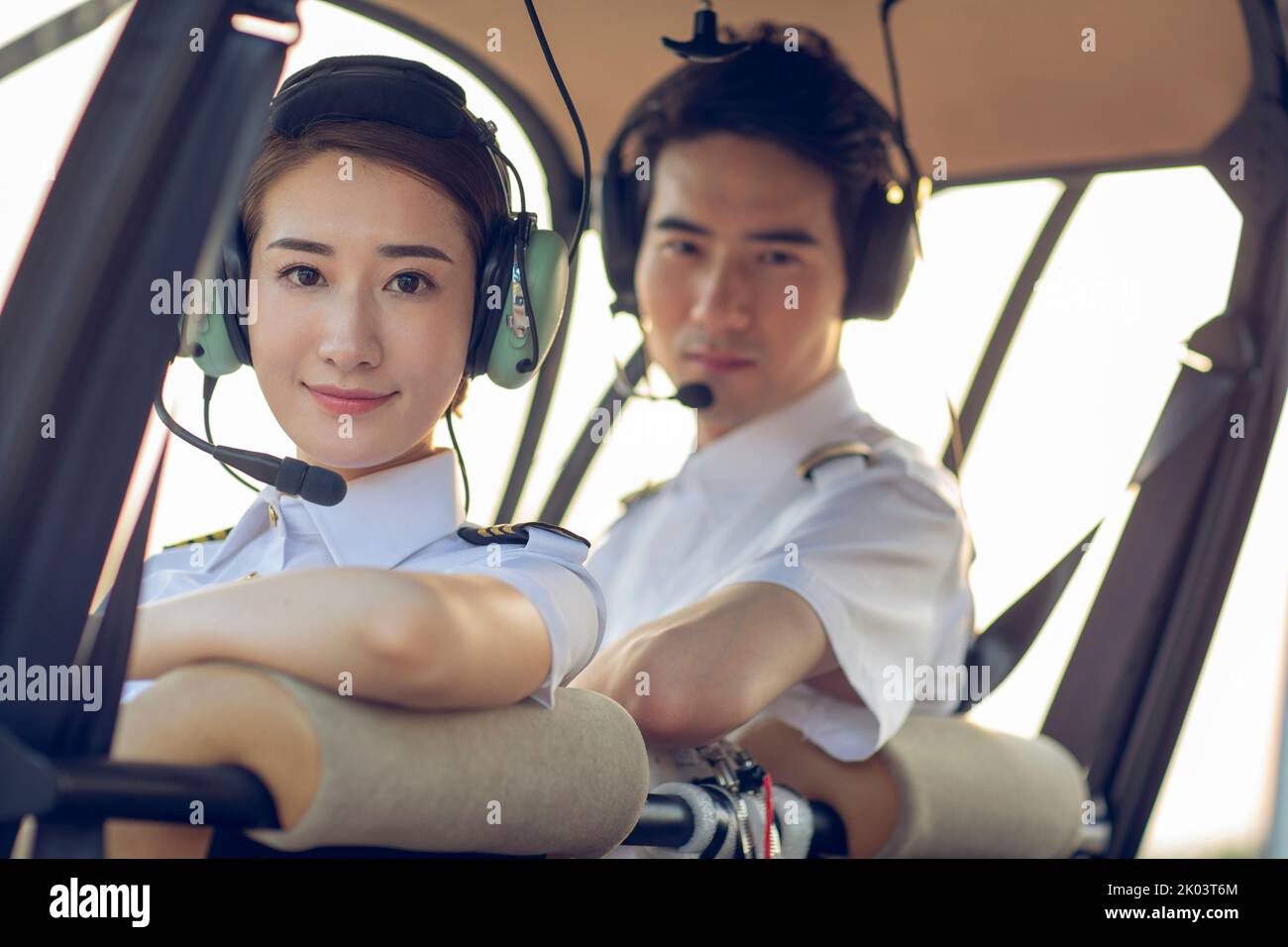 Chinese pilots sitting in helicopter cockpit Stock Photo - Alamy