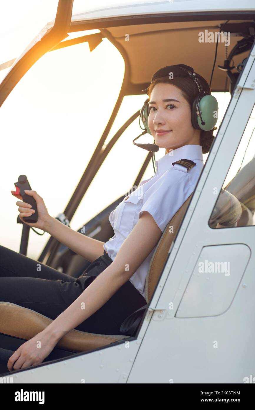 Chinese pilot sitting in helicopter cockpit Stock Photo - Alamy