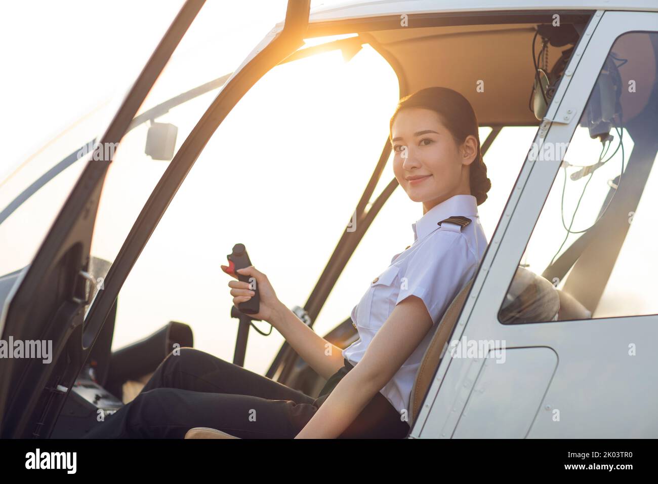 Chinese pilot sitting in helicopter cockpit Stock Photo - Alamy