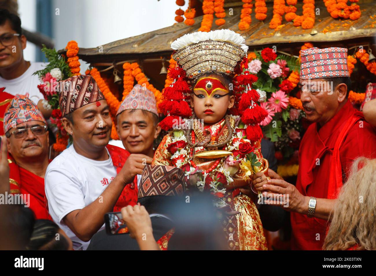 Caretakers carry Nepal’s Living Goddess Kumari on her chariot during ...