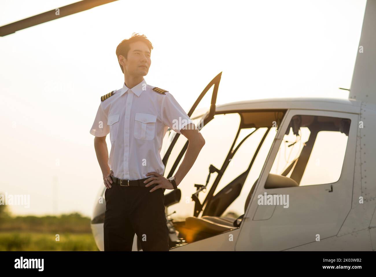 Chinese helicopter pilot standing by the vehicle Stock Photo - Alamy