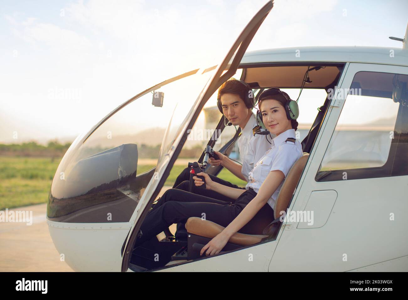 Chinese pilots sitting in helicopter cockpit Stock Photo - Alamy
