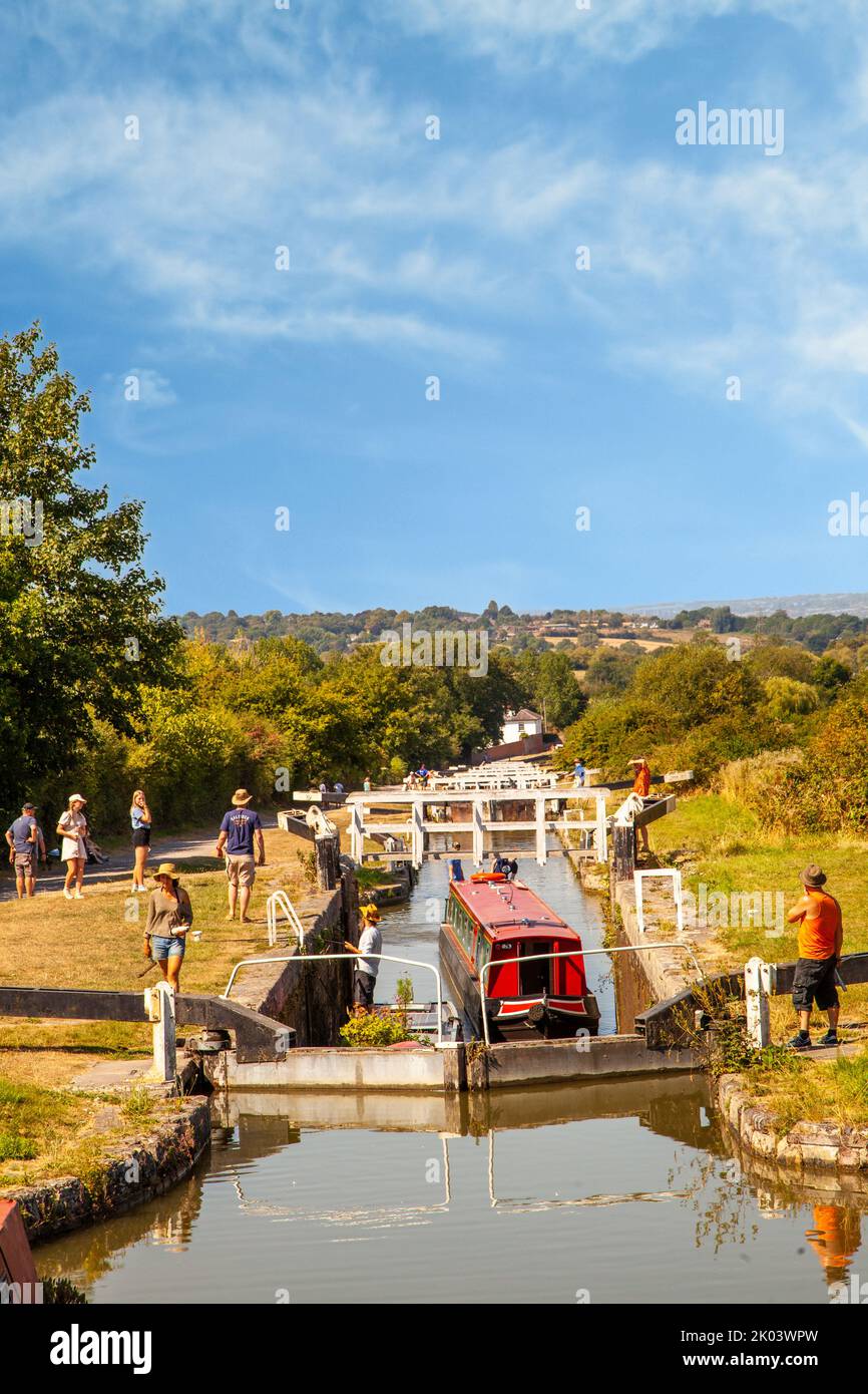 Canal narrowboats at Caen Hill Locks, a flight of 29 locks on the ...
