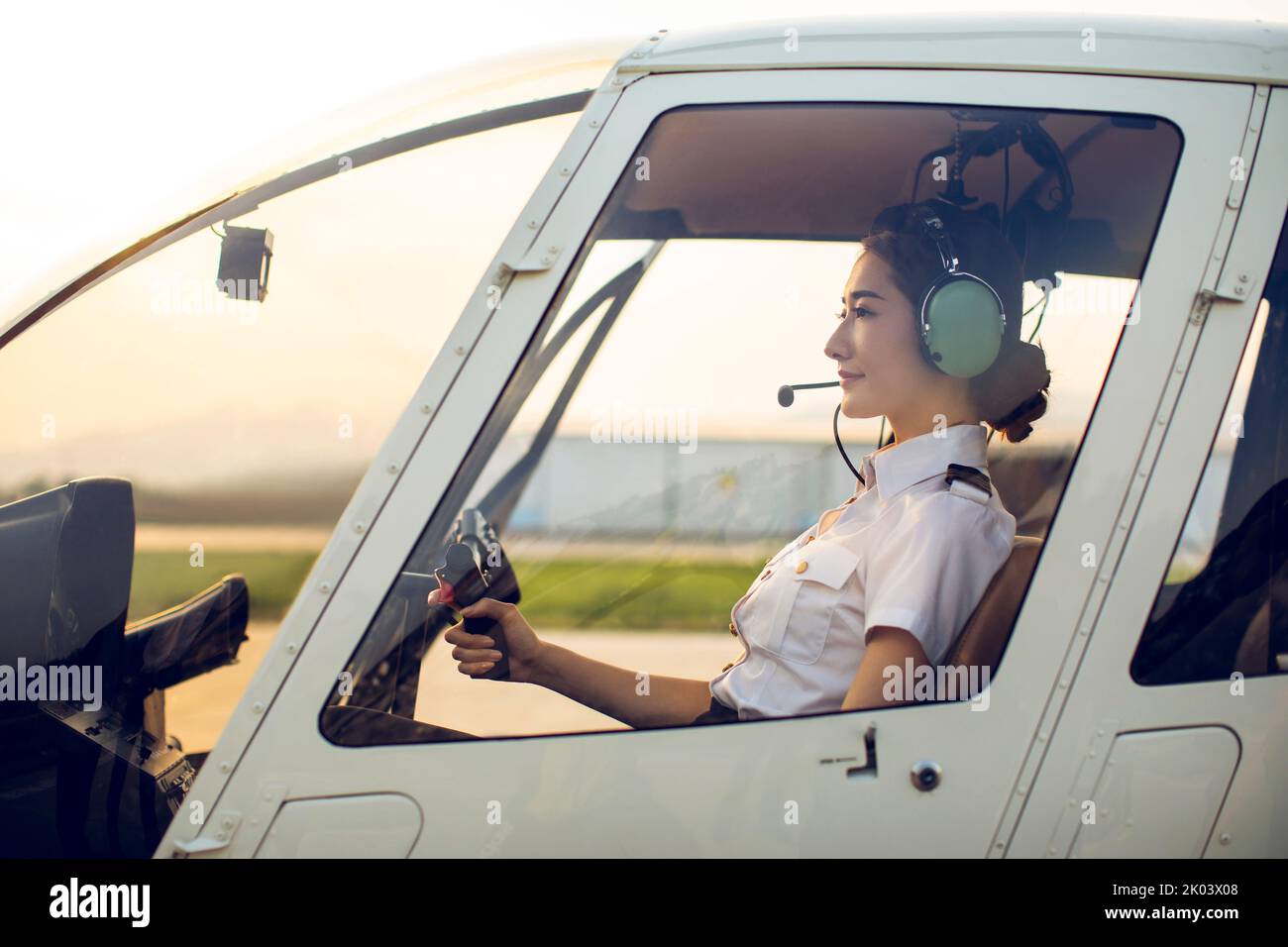 Chinese pilot sitting in helicopter cockpit Stock Photo - Alamy