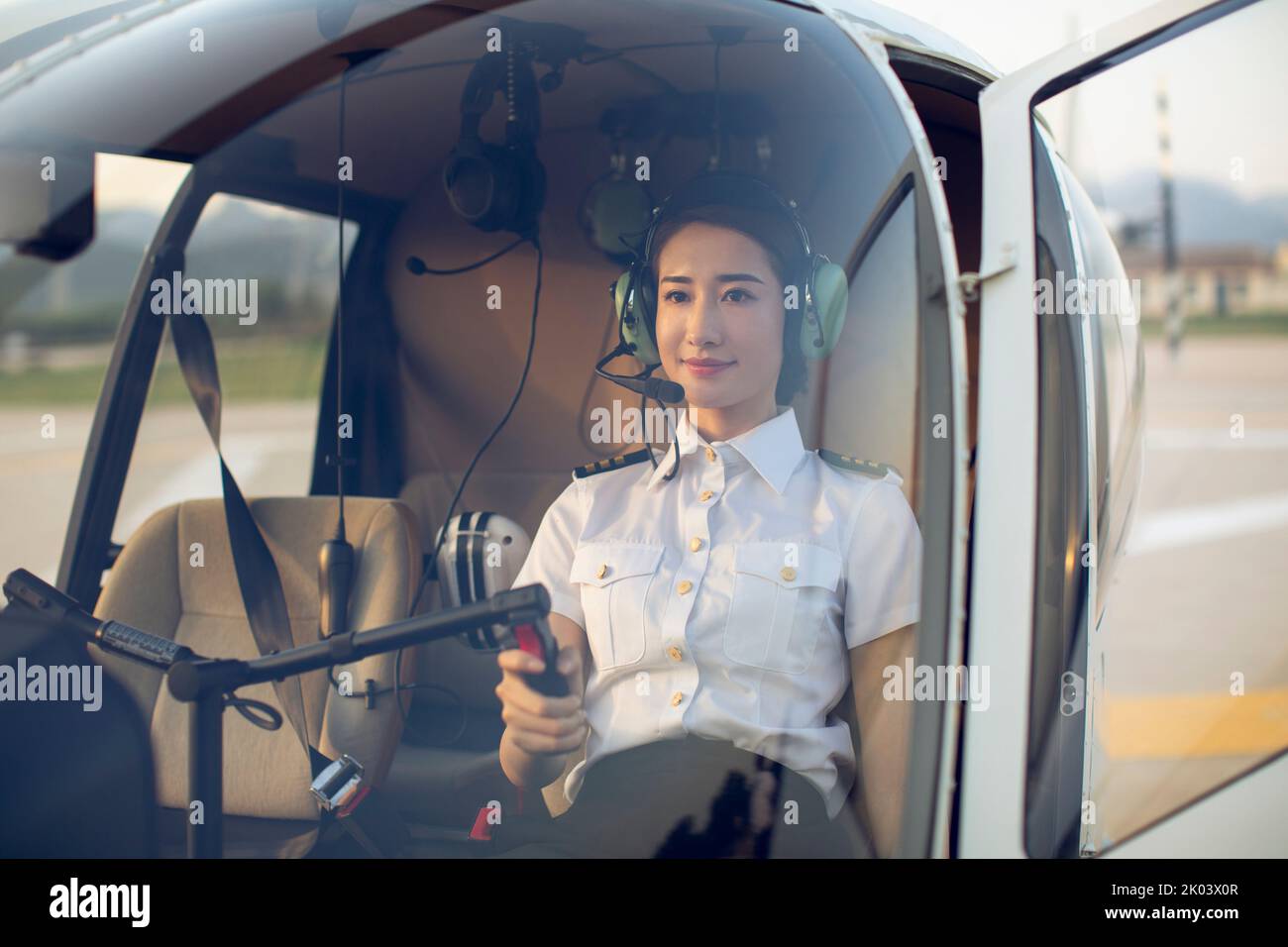 Chinese pilot sitting in helicopter cockpit Stock Photo - Alamy