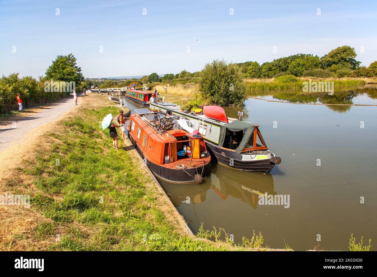 Canal narrowboats at Caen Hill Locks, a flight of 29 locks on the ...