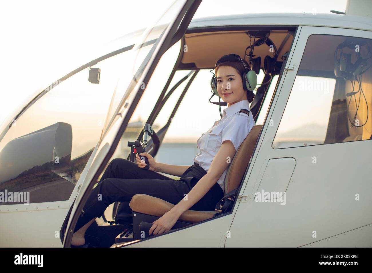 Chinese pilot sitting in helicopter cockpit Stock Photo - Alamy