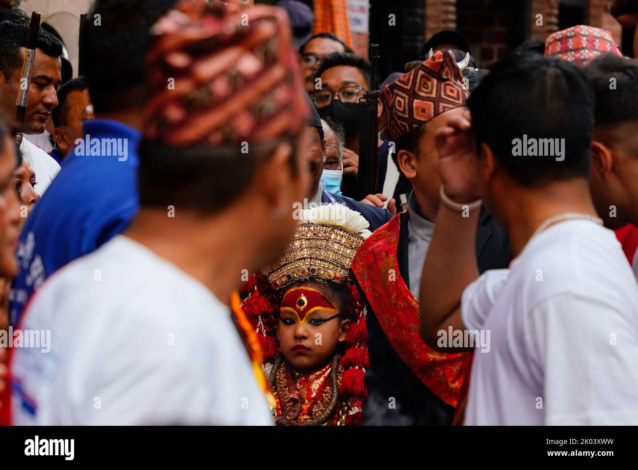 Nepal’s Living Goddess Kumari is taken to her chariot by caretakers ...