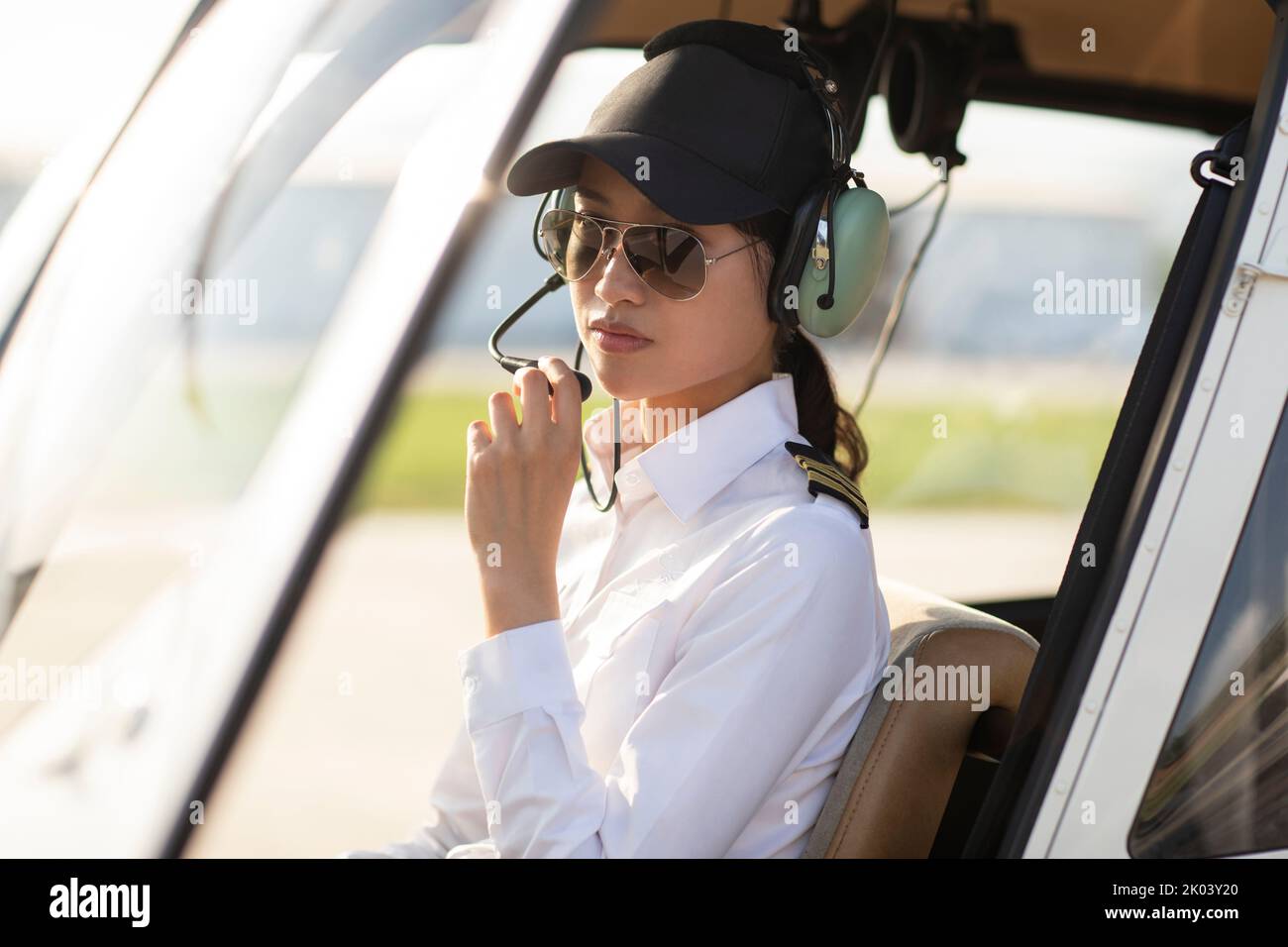 Chinese pilot sitting in helicopter cockpit Stock Photo - Alamy