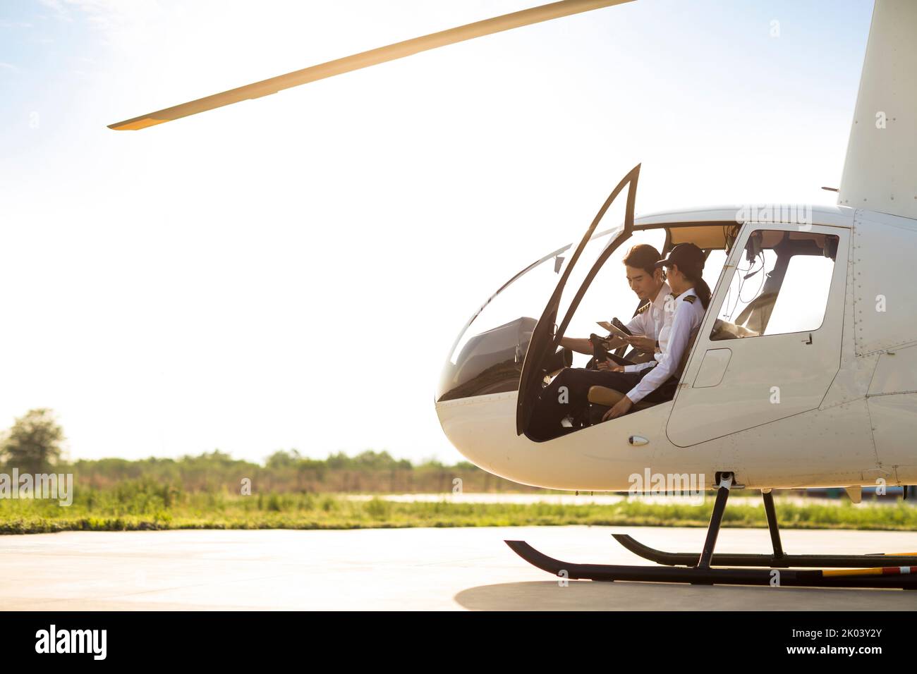 Chinese pilots sitting in helicopter cockpit Stock Photo - Alamy