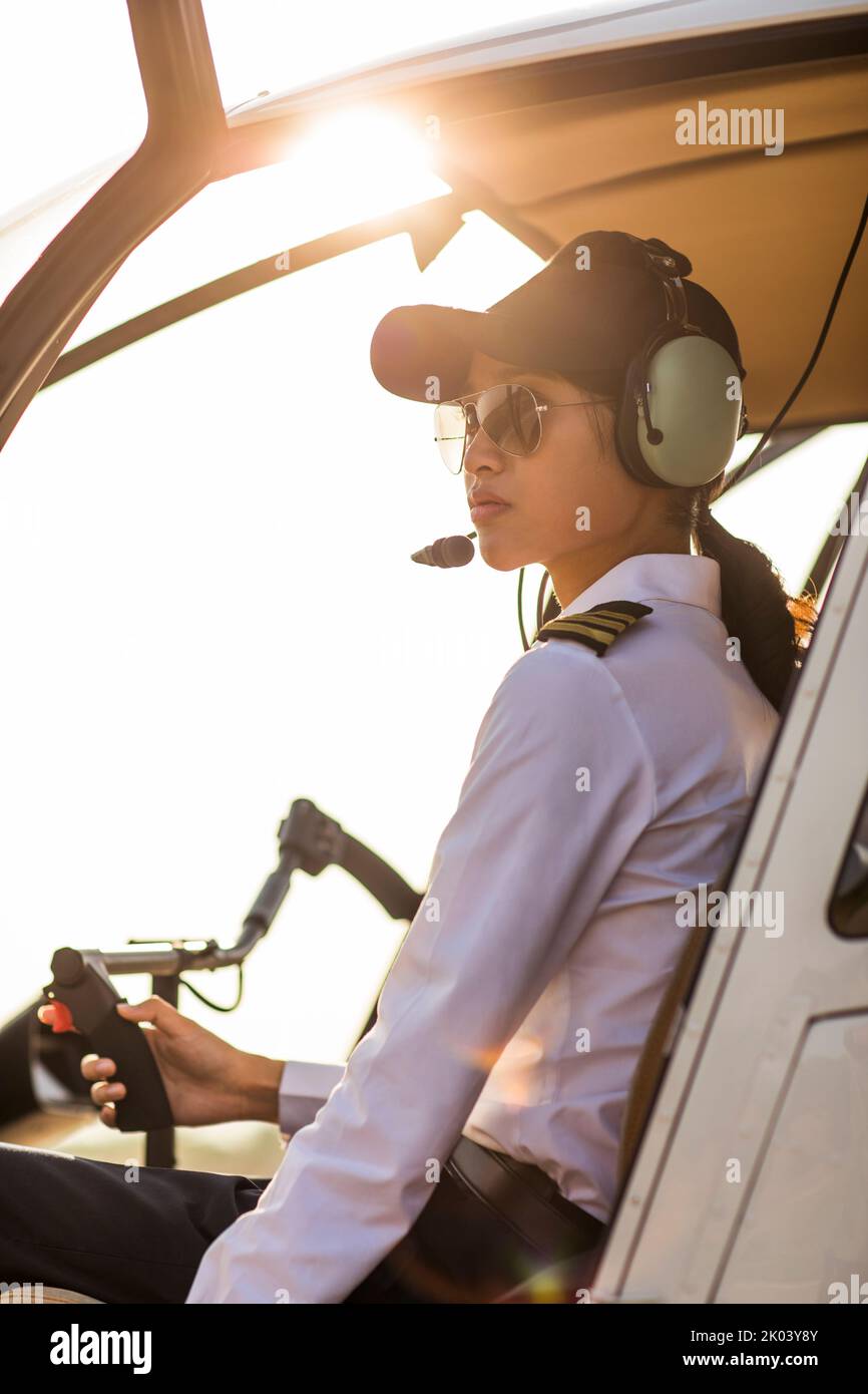 Chinese pilot sitting in helicopter cockpit Stock Photo - Alamy
