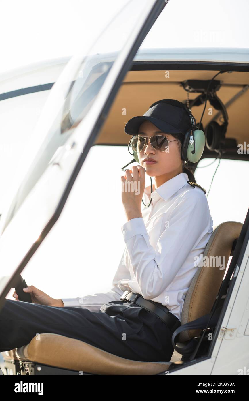 Chinese pilot sitting in helicopter cockpit Stock Photo - Alamy