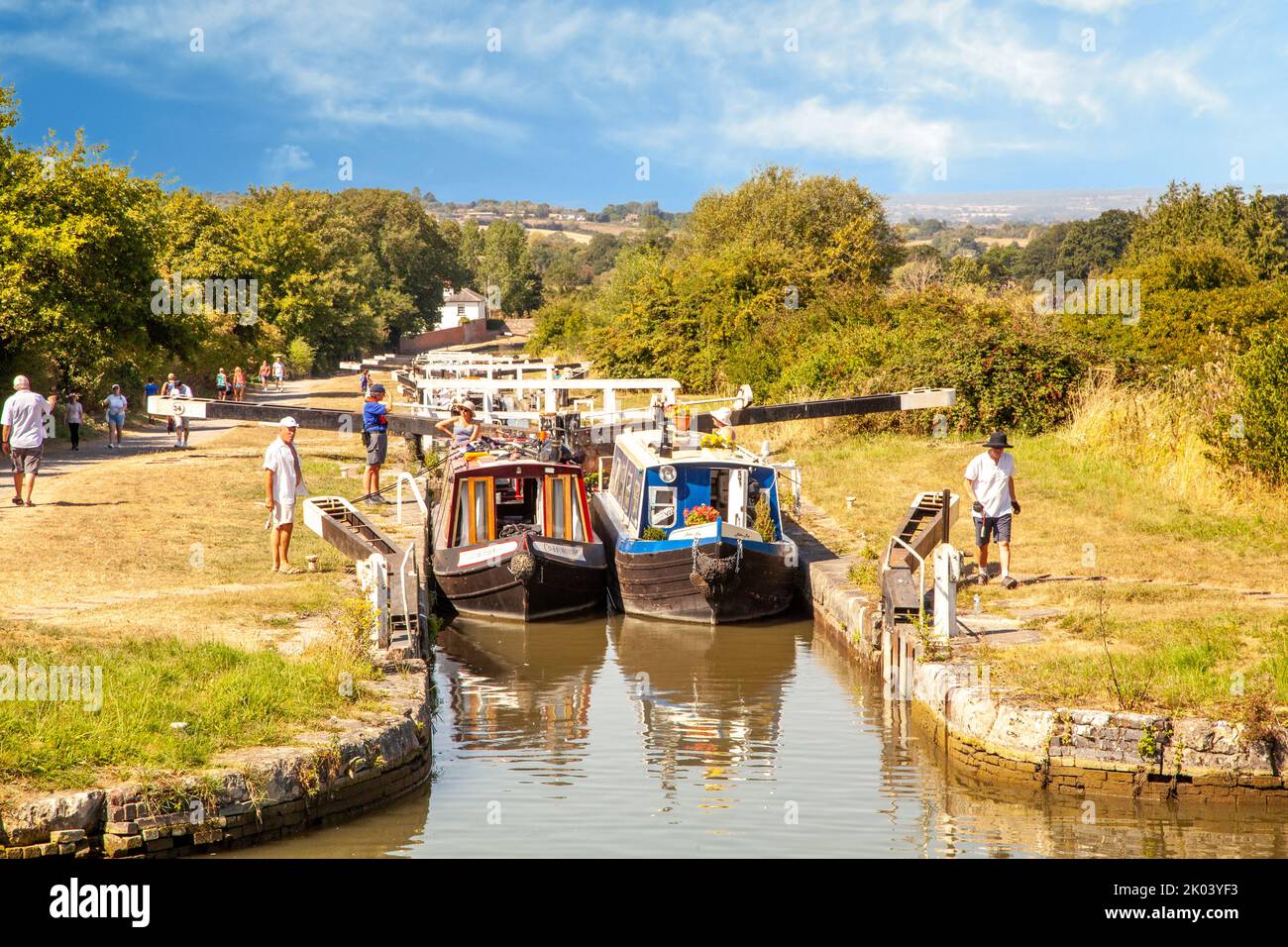 Canal narrowboats at Caen Hill Locks, a flight of 29 locks on the ...