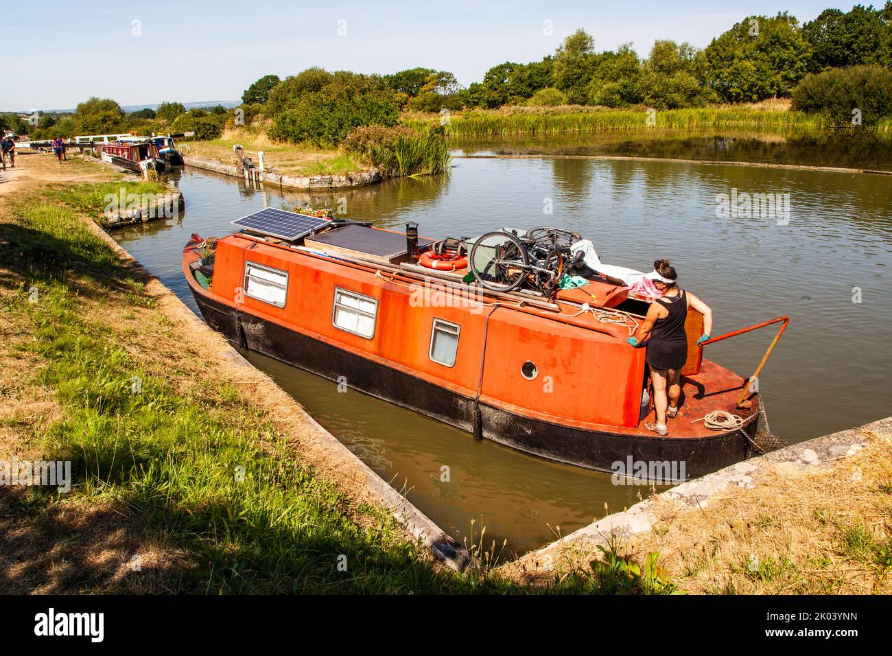 Canal narrowboats at Caen Hill Locks, a flight of 29 locks on the ...