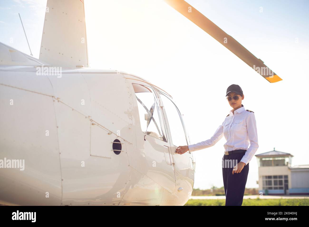 Chinese helicopter pilot standing by the vehicle Stock Photo - Alamy