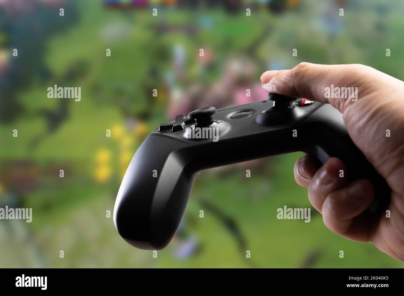 Modern joystick, gamepad GAM22ICB on the background of a video game on ...