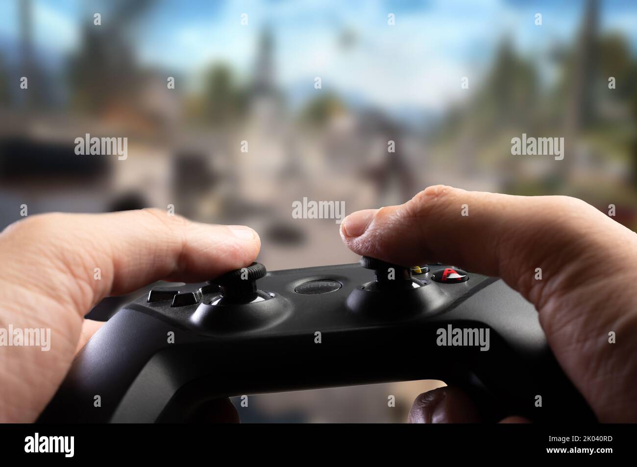 Video games. Modern joystick GAM22ICB in the hands of a gamer on the ...