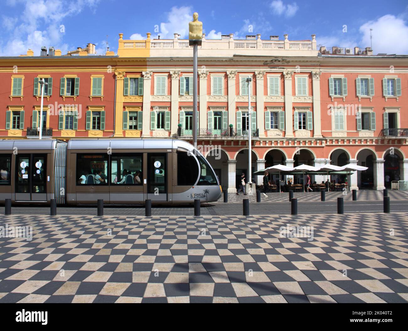 A tram arrives on the famous Italian style Place Masséna located in the ...