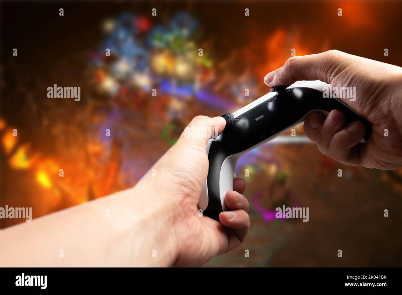 Video games. On a fantasy background, a joystick in the hands of a ...