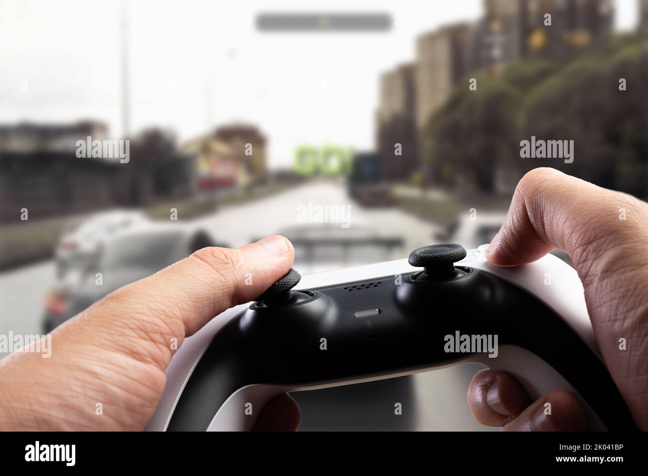 GAM22ICB joystick, gamepad in a gamer's hand in front of a large TV ...