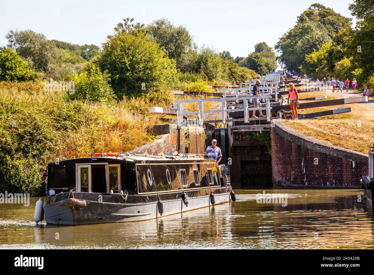 Canal narrowboats at Caen Hill Locks, a flight of 29 locks on the ...