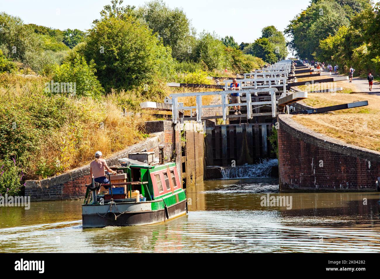 Canal narrowboats at Caen Hill Locks, a flight of 29 locks on the ...
