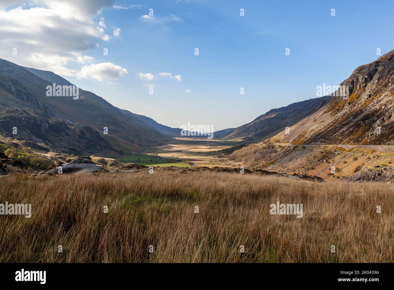 A view of Nant Ffrancon with the slate tips of Penrhyn Quarry at the ...