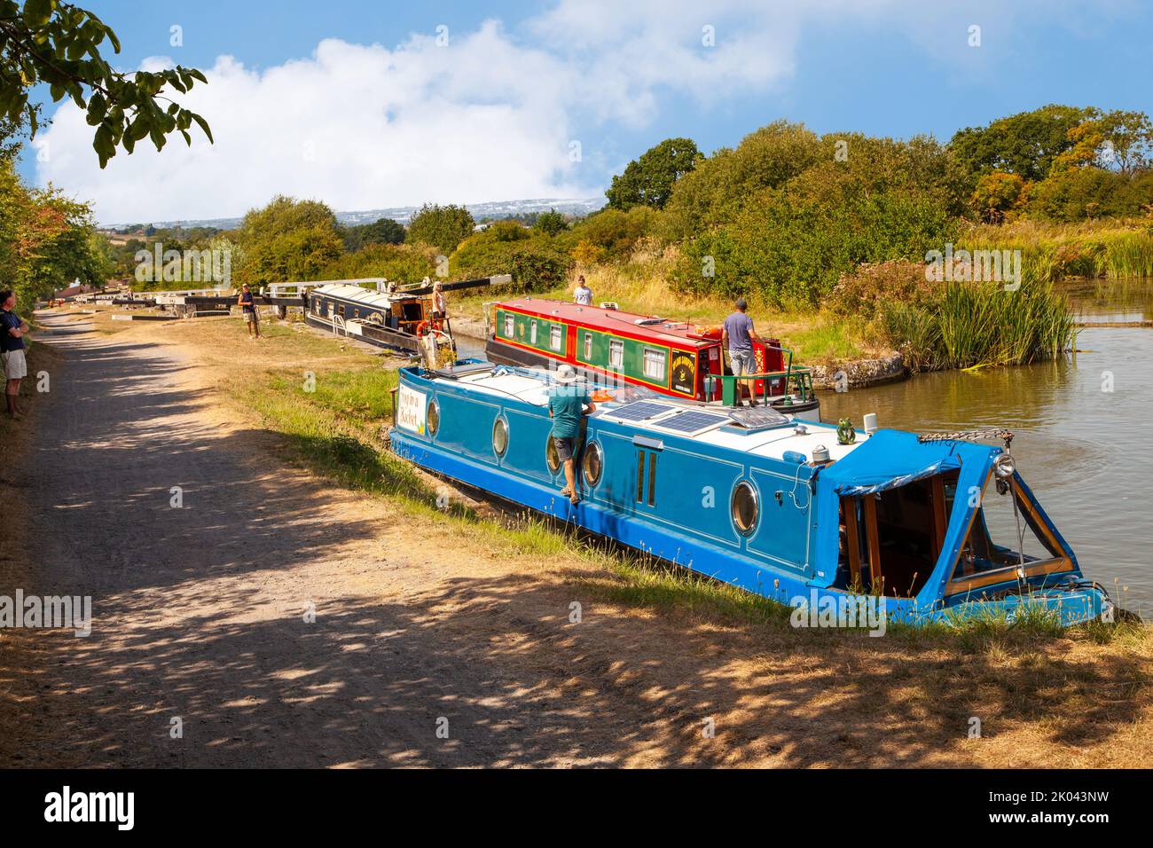 Canal narrowboats at Caen Hill Locks, a flight of 29 locks on the ...