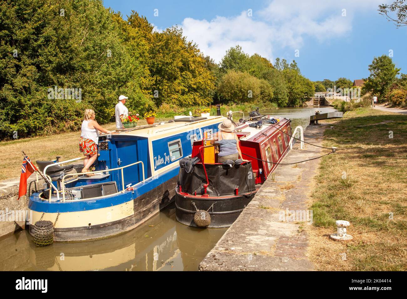 Canal narrowboats at Caen Hill Locks, a flight of 29 locks on the ...