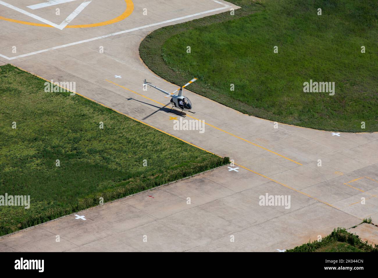 High angle view of helicopter landing on airfield Stock Photo - Alamy
