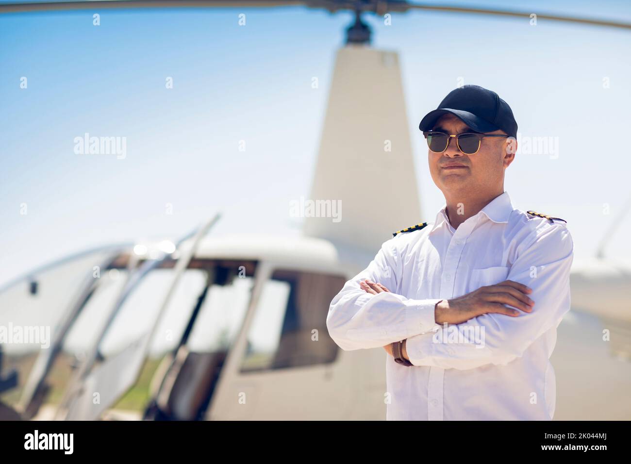 Chinese helicopter pilot standing by the vehicle Stock Photo - Alamy