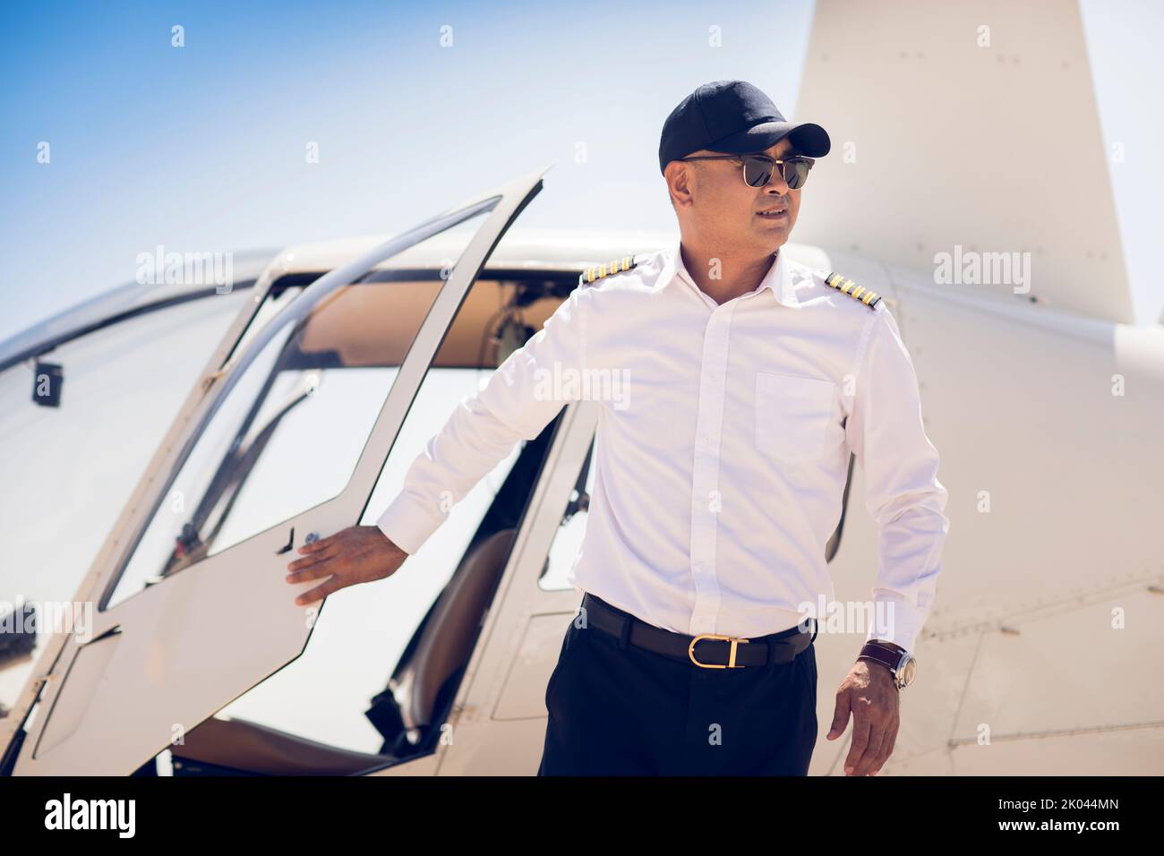 Chinese helicopter pilot standing by the vehicle Stock Photo - Alamy